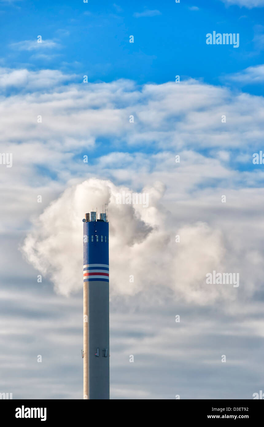 A factory funnel spews out steam in the atmosphere Stock Photo - Alamy