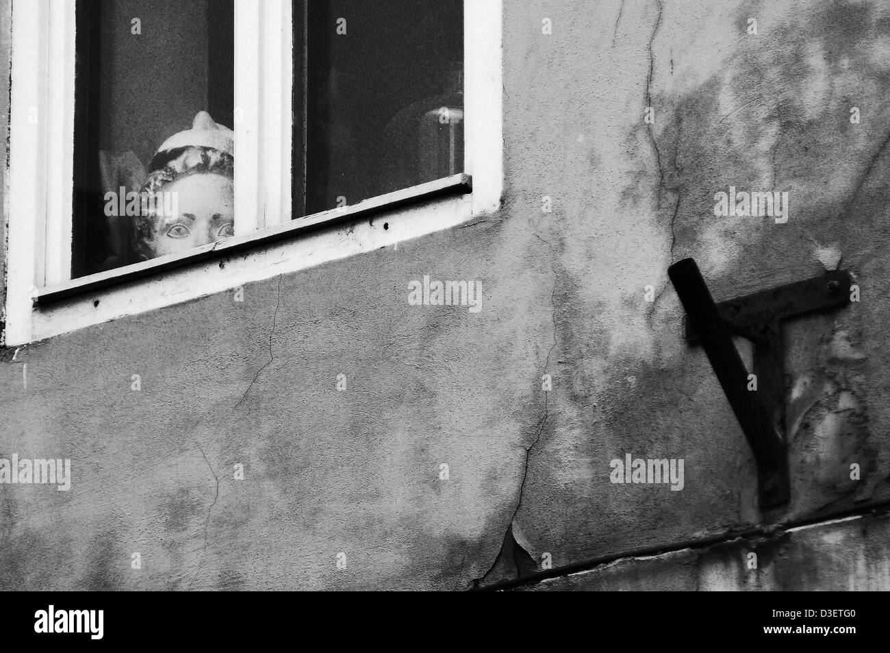 The statue in the window Stock Photo - Alamy