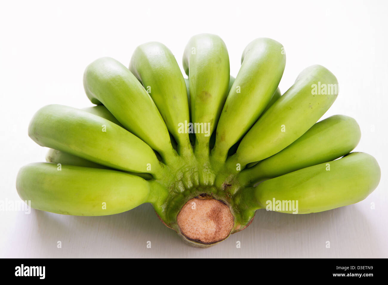 Closed up Thai unripe banana on white background Stock Photo - Alamy