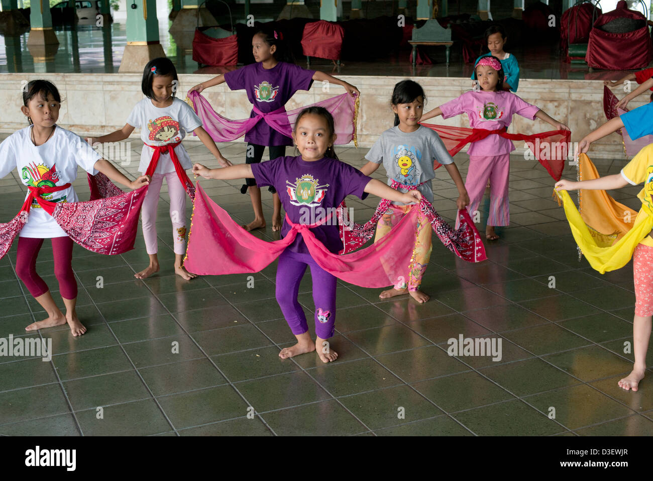 A group of young Javanese dance students practice traditional dance ...