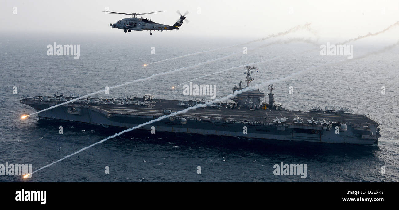 Aerial view of a US Navy MH-60R Sea Hawk helicopter launching anti ...
