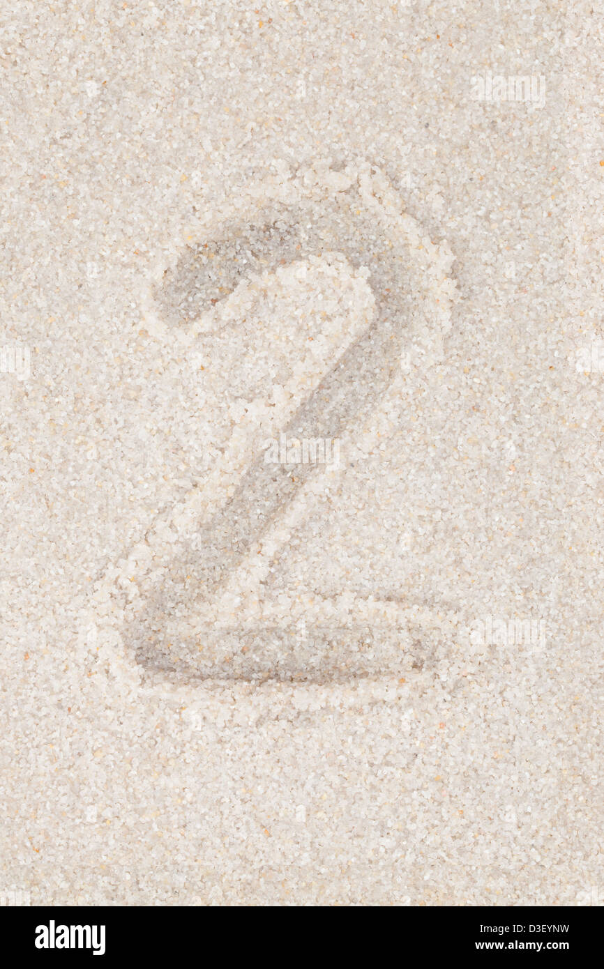 Digits on sand - clean background - 2 - Two Stock Photo - Alamy