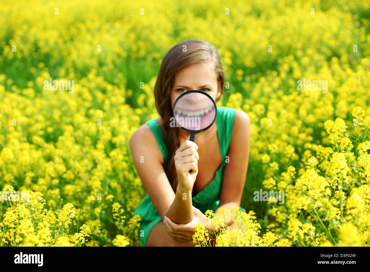 botanist woman in yellow flower field Stock Photo - Alamy