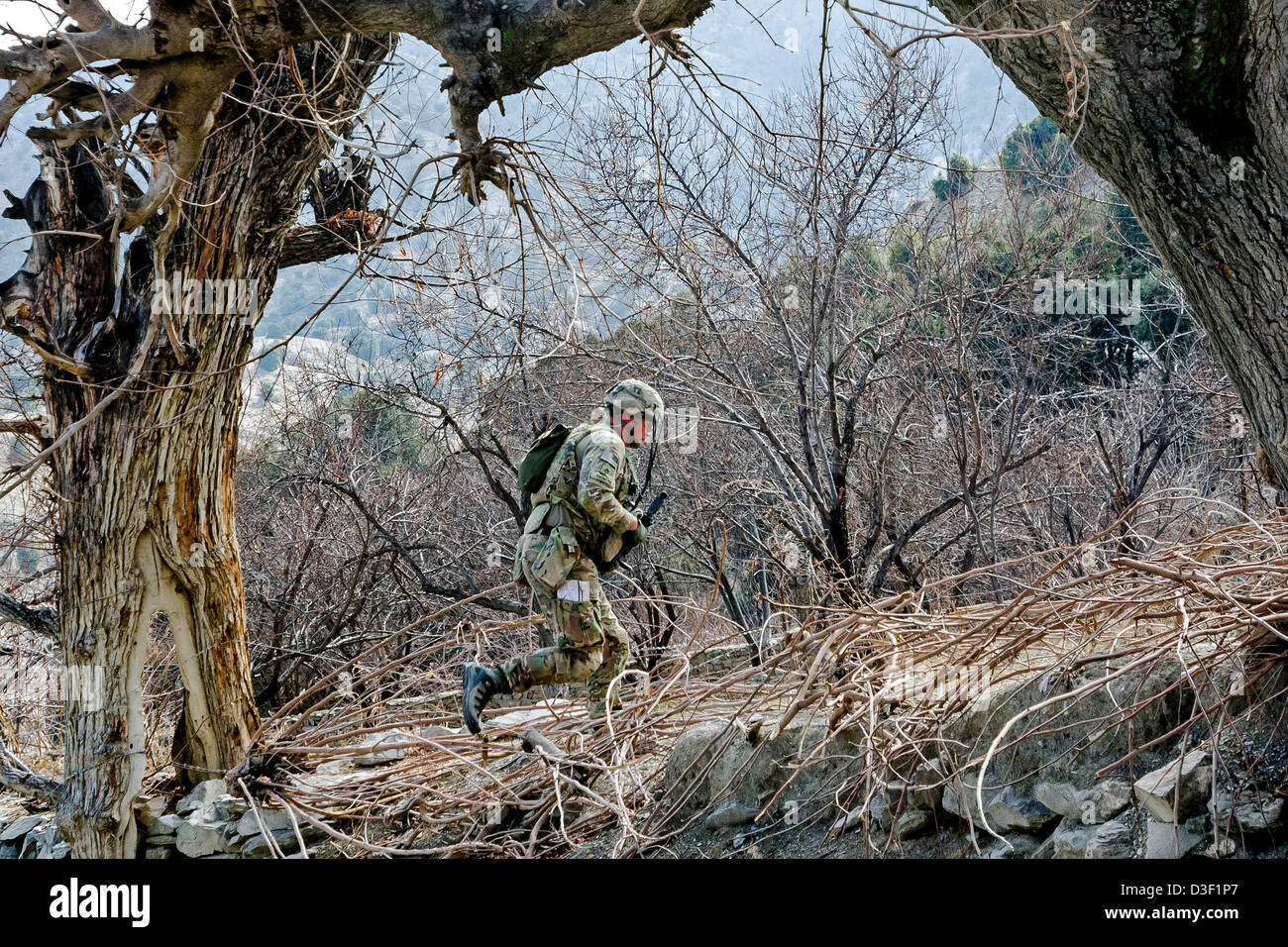 US Army Airborne soldiers run up a hillside during a security patrol in ...