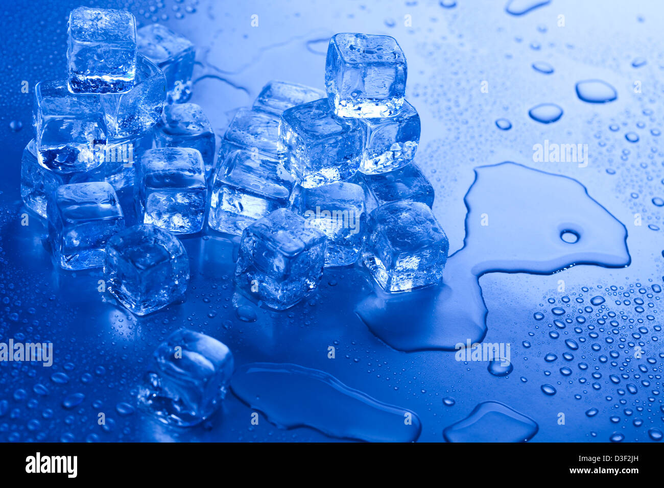Blue background and ice cubes Stock Photo - Alamy