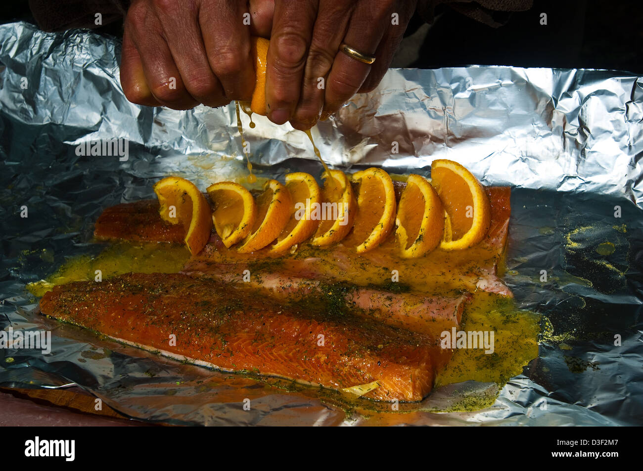Alaskan fishing guide preparing Arctic char fillets for a shore lunch ...