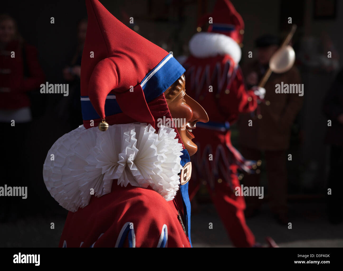 People dressed as jesters , take part in a parade in Konstanz, Germany ...