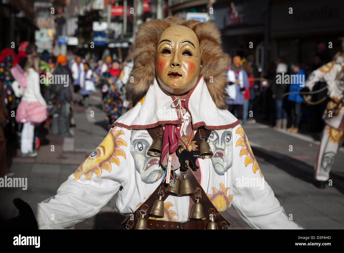 People dressed as jesters , take part in a parade in Konstanz, Germany ...