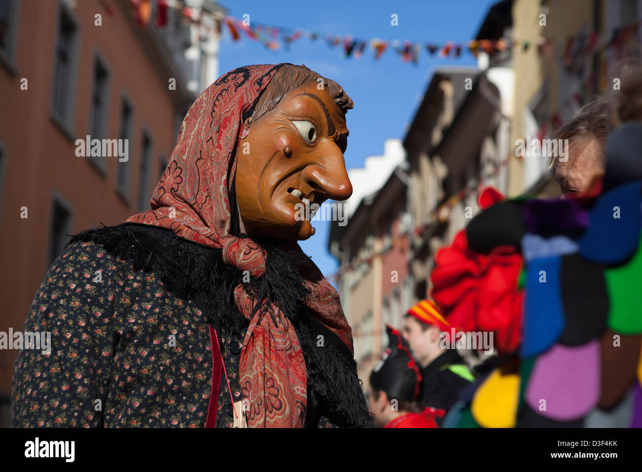 People dressed as jesters , take part in a parade in Konstanz, Germany ...