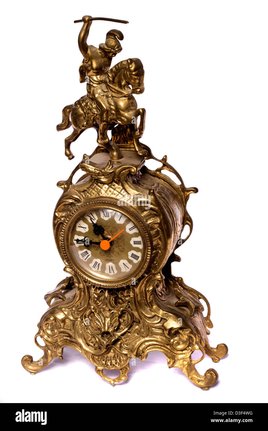 Close up view of a iron and golden retro clock, isolated on a white ...