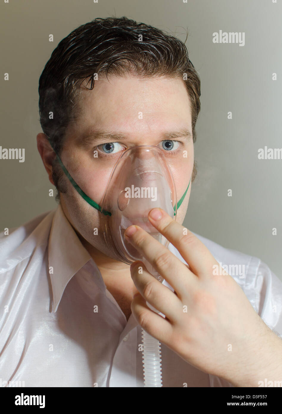 Portrait of young man with inhalator mask on the face Stock Photo - Alamy