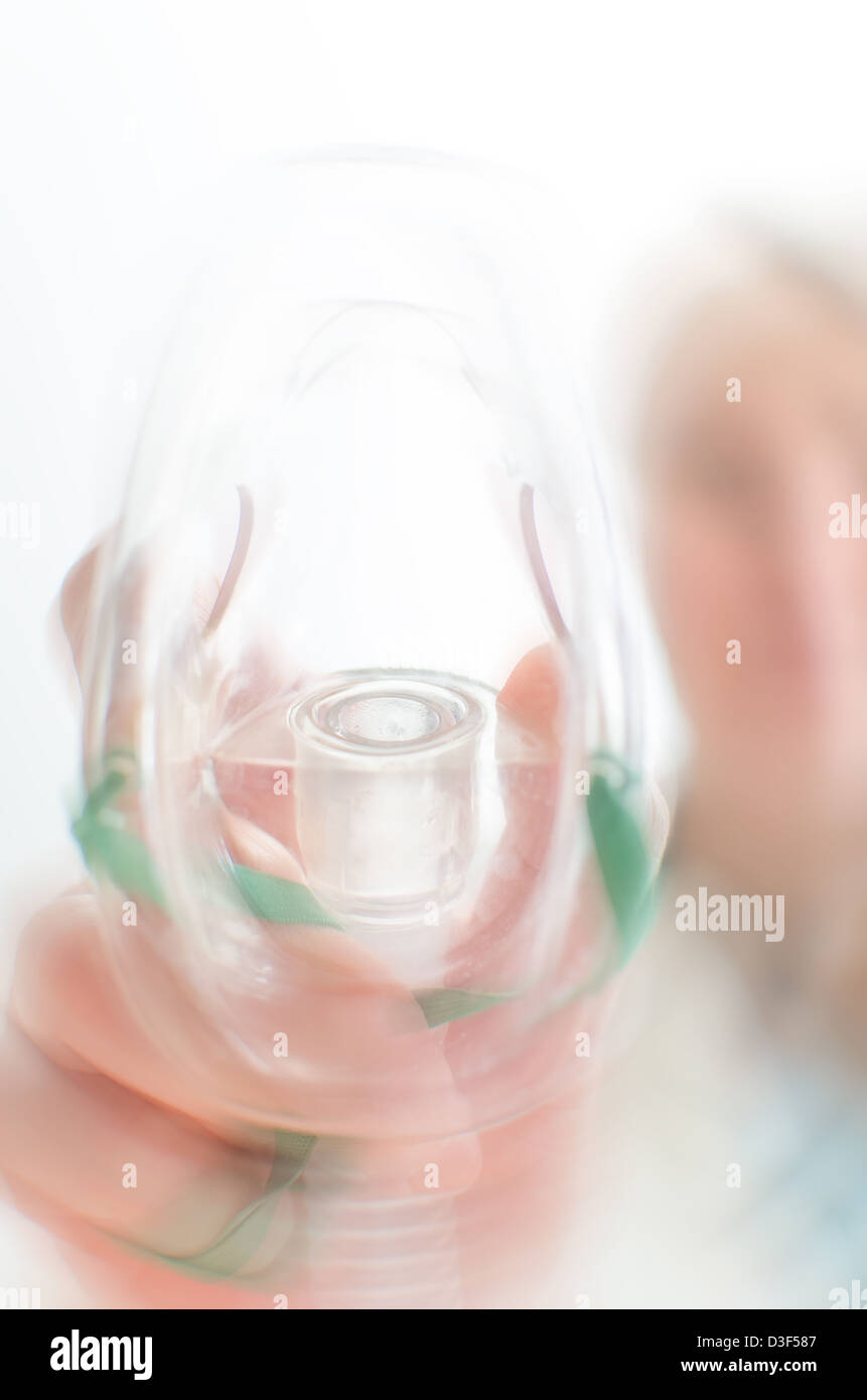 Female assisitant giving gas mask to patient Stock Photo - Alamy