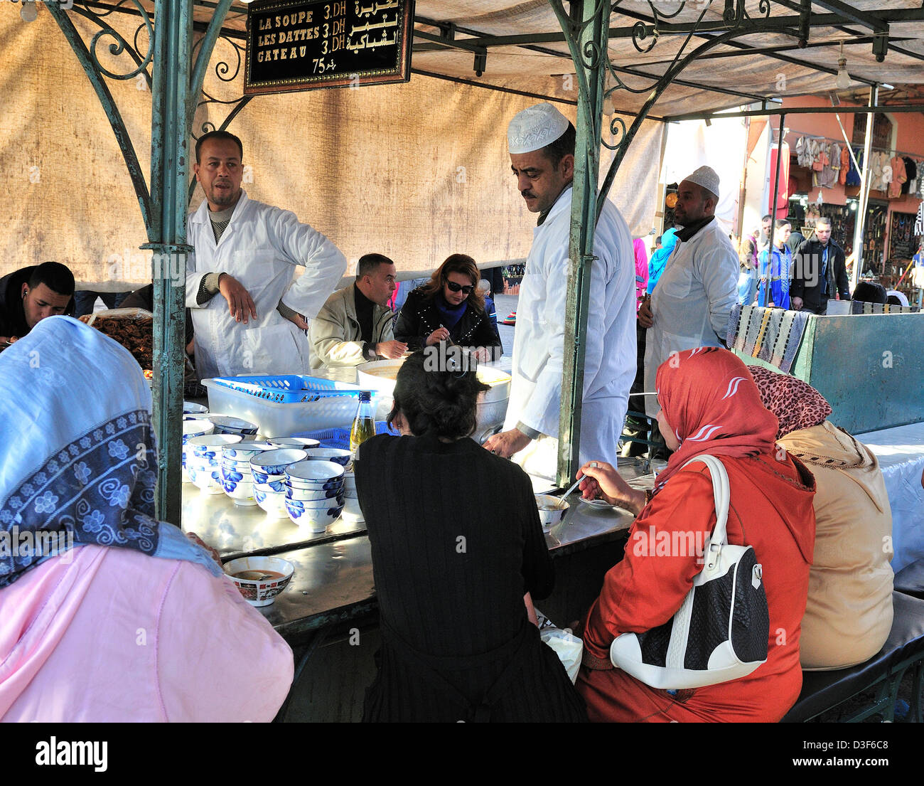 People eating from the food stalls on the famous market square on Jemma ...