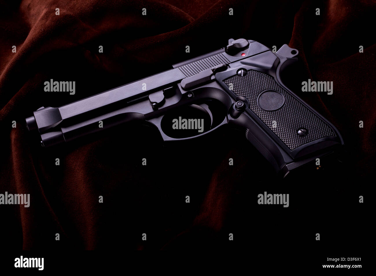 Detail view of a realistic airsoft gun isolated on a white background ...