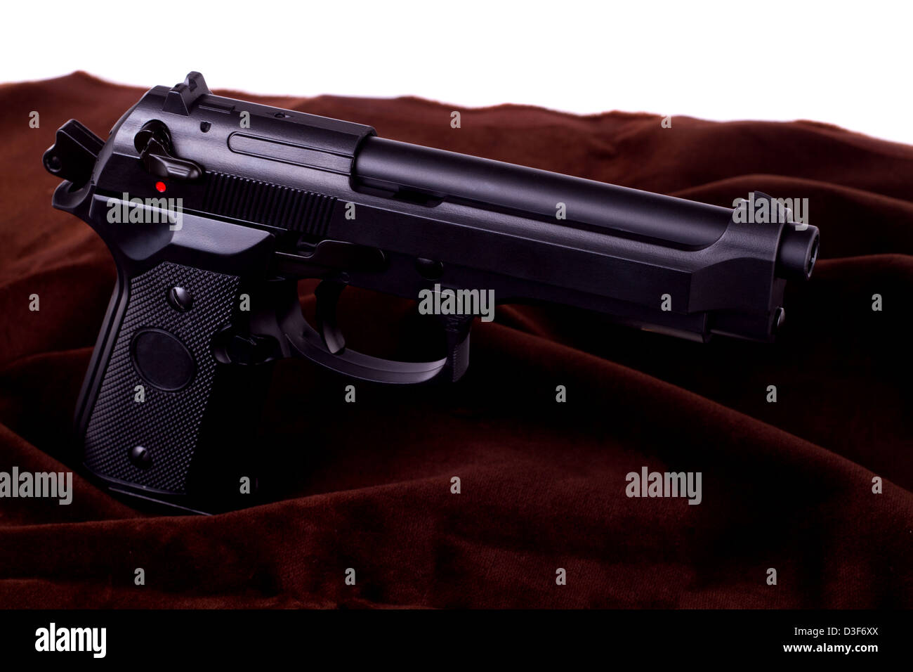 Detail view of a realistic airsoft gun isolated on a white background ...