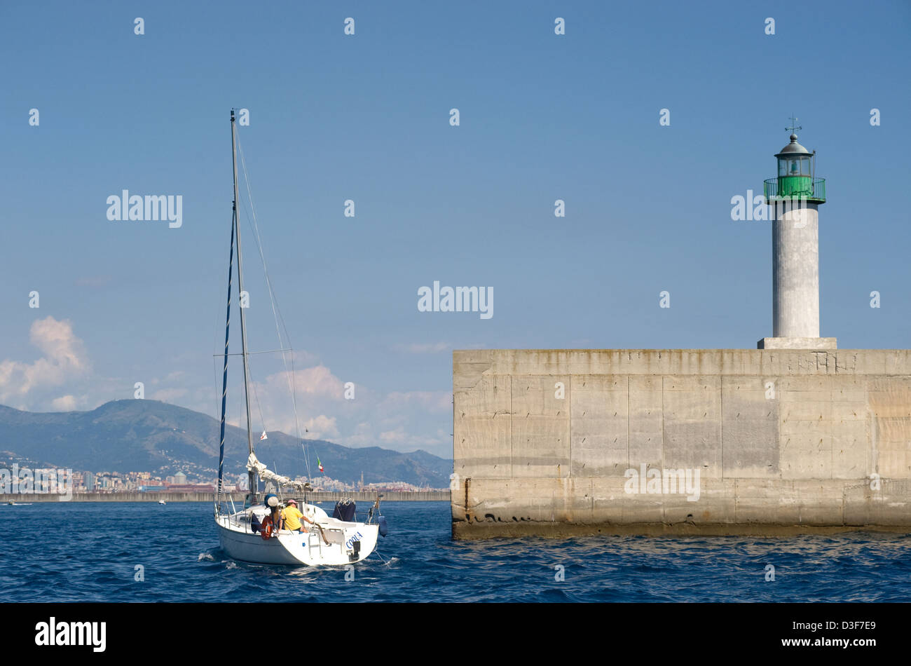 Genoa, Italy, lighthouse at the breakwater of the container port in ...