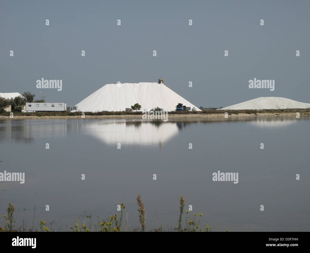 Scenic view of salt mountains during salt harvesting, Les Salins du ...