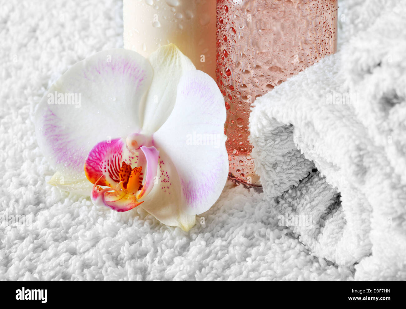 Bodycare products and a beautiful orchid Stock Photo - Alamy