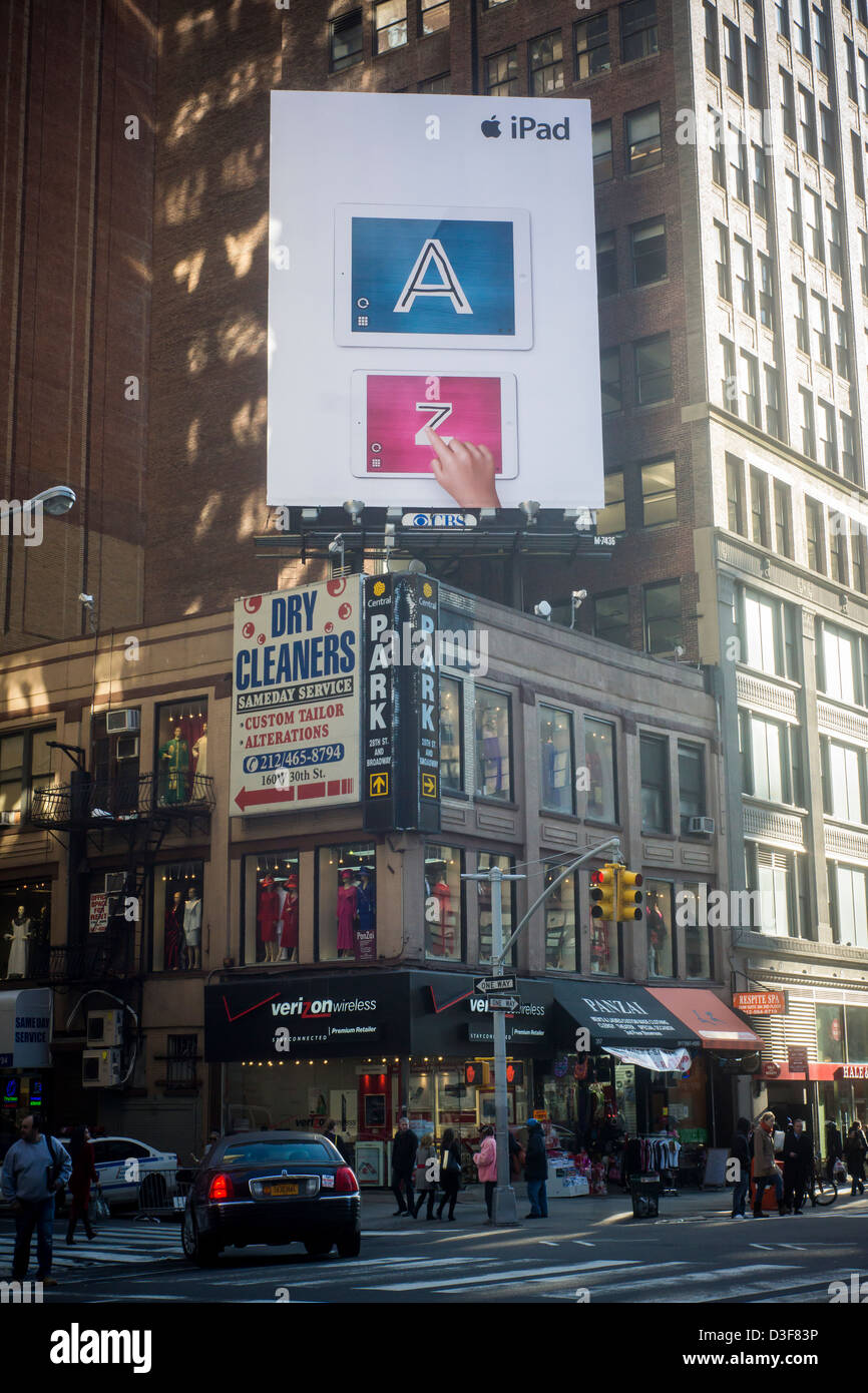 Advertising for the Apple iPad and the iPad Mini on a billboard in ...