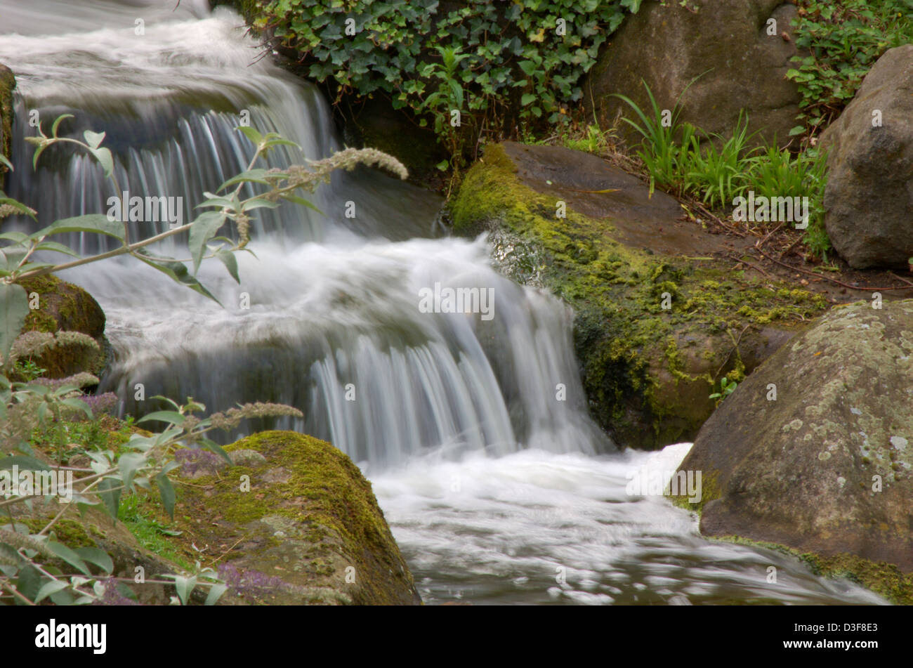 Water fleowing down a small waterfall Stock Photo - Alamy