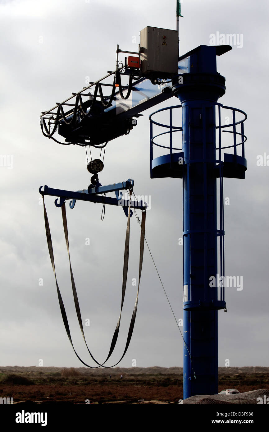 Silhouette view of a blue commercial dock lifter Stock Photo - Alamy