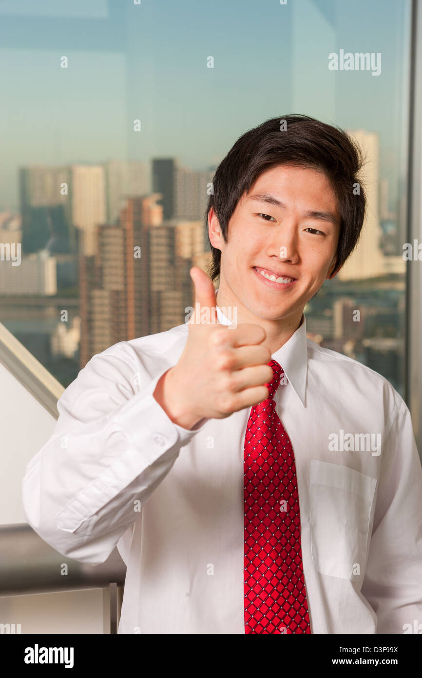 Businessman thumbs up Stock Photo - Alamy