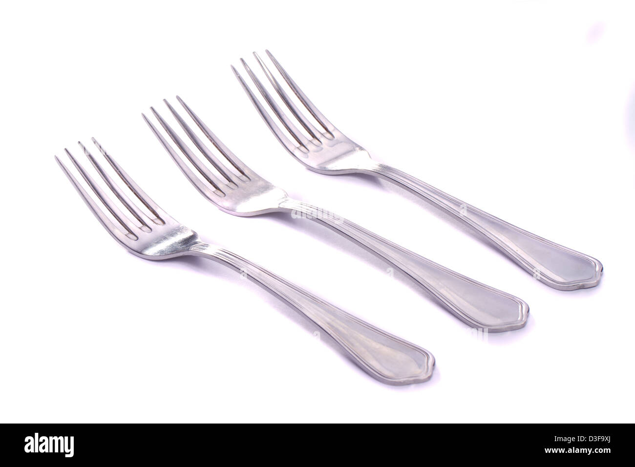 Close up view detail of some forks isolated on a white background Stock ...