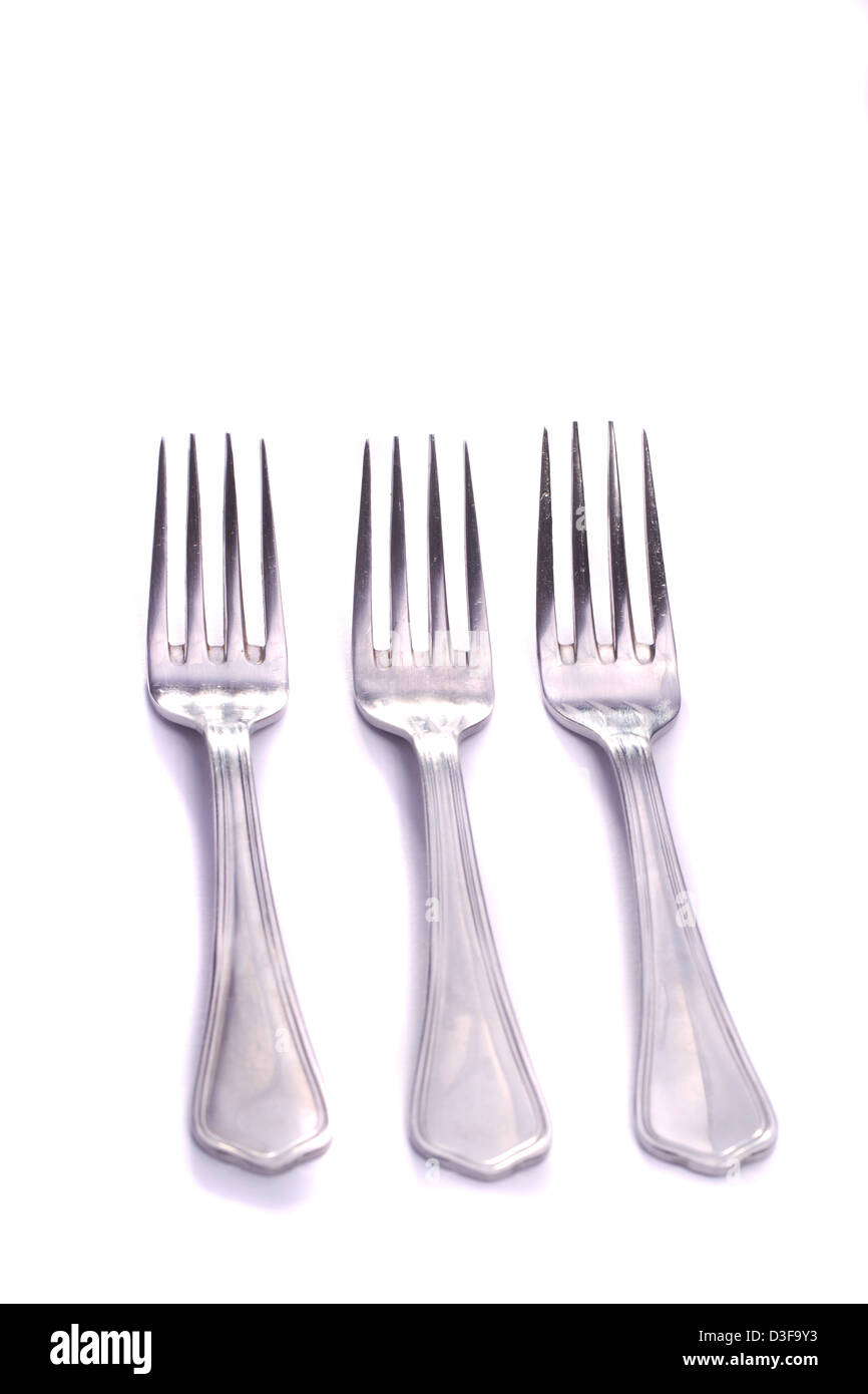 Close up view detail of some forks isolated on a white background Stock ...