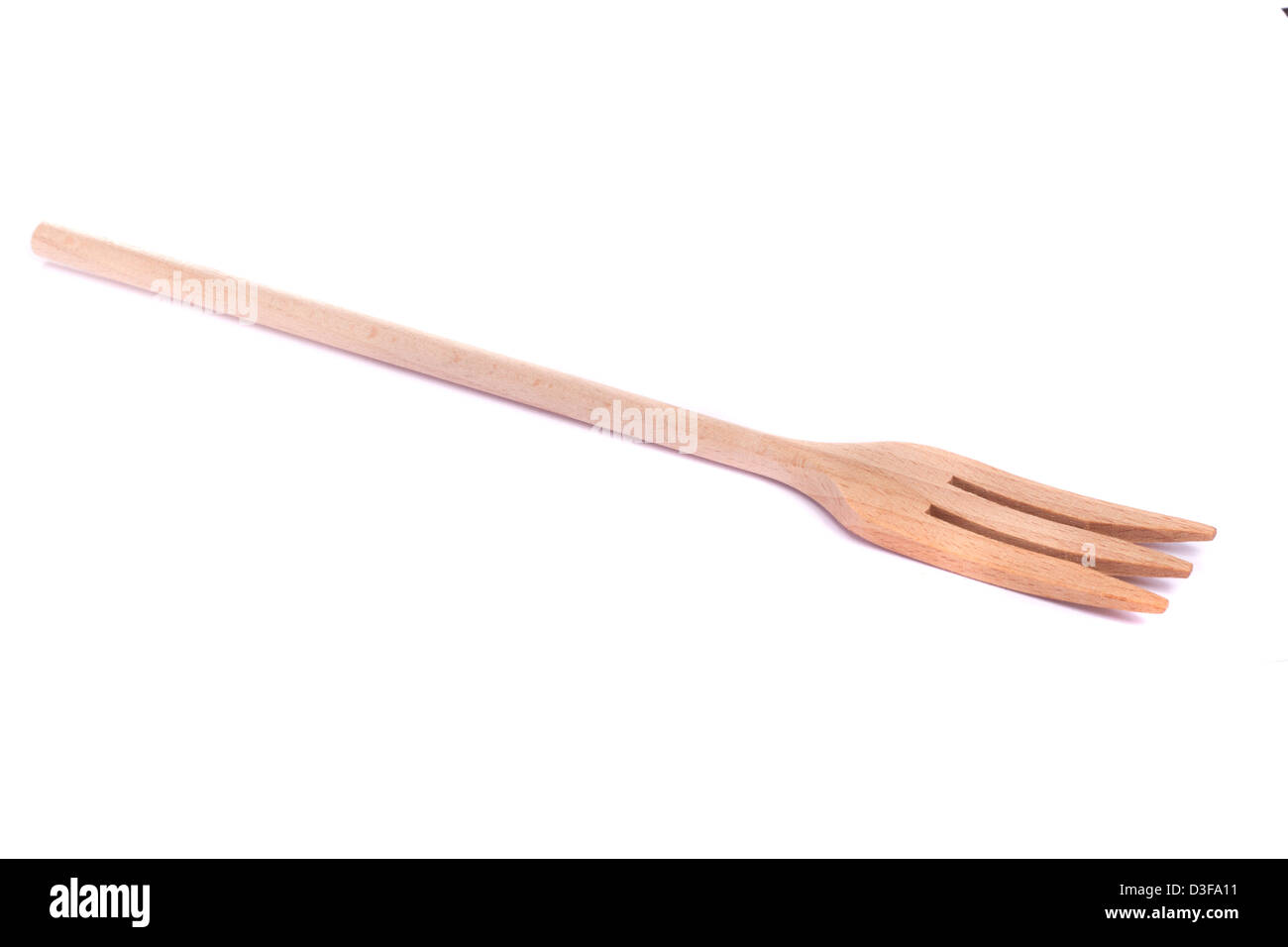 Close view detail of a kitchen wooden fork isolated on a white ...