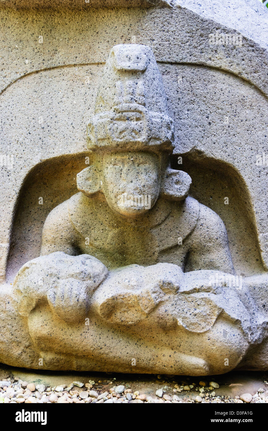 Altar 5 Olmec carving. Seated male figure holding a child on his knees ...
