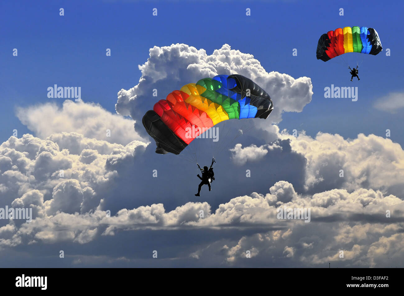 Two colorful parachutes on stormy sky Stock Photo - Alamy