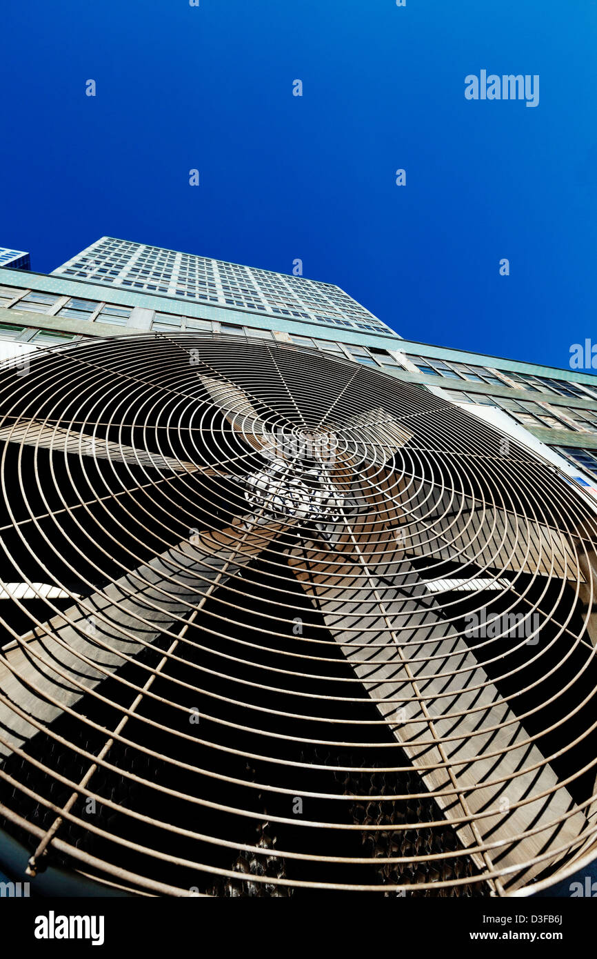 Wide angle view of an outdoor HVAC air conditioner unit located on a ...