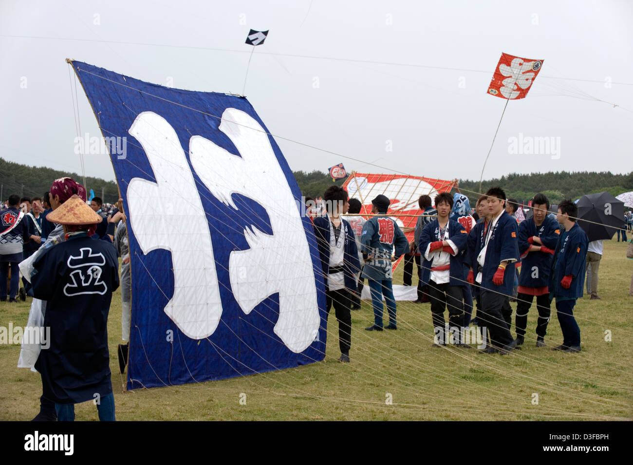 Kite flying team members hold kite prior to launch at Hamamatsu Takoage ...