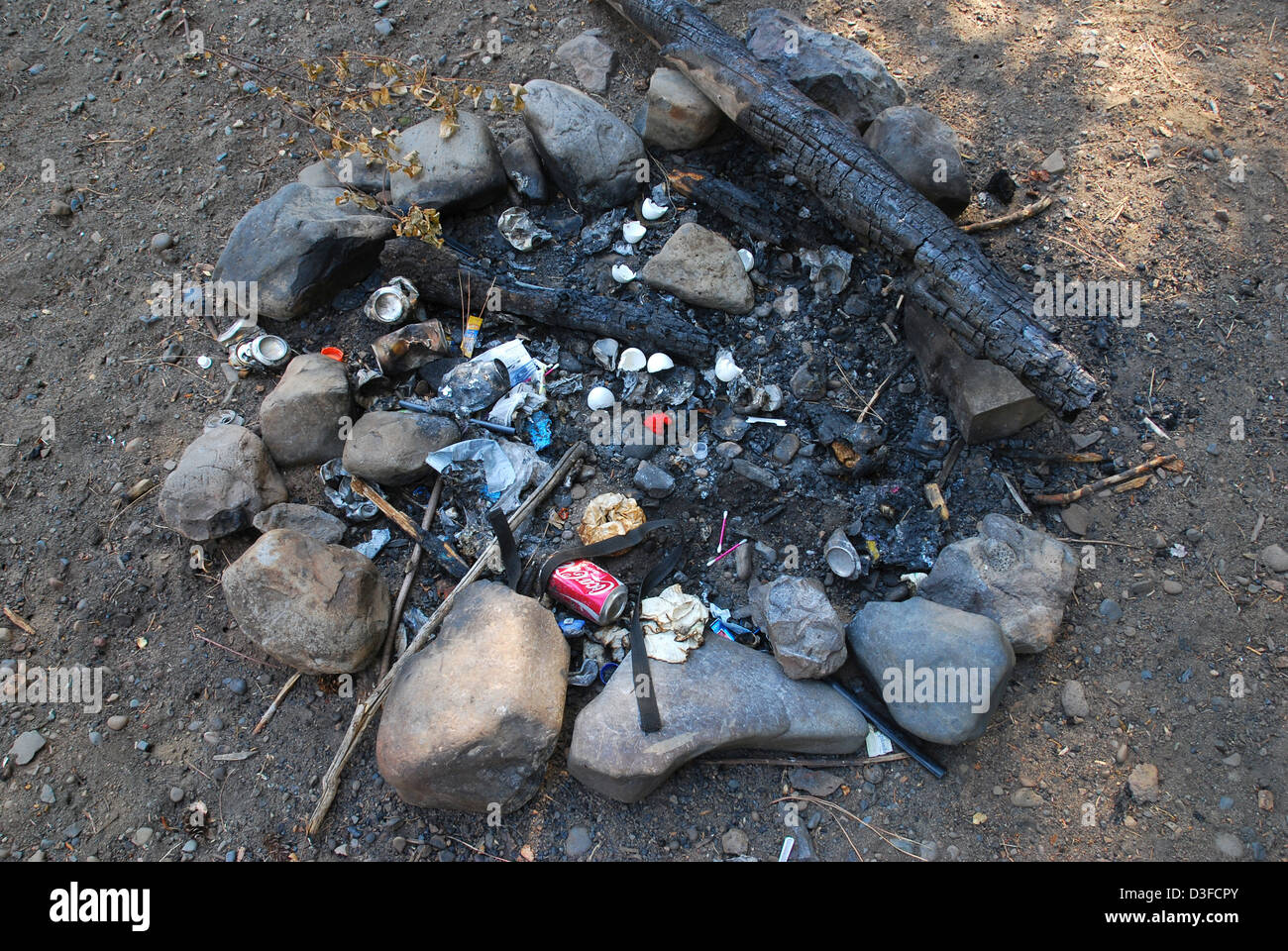 Garbage in a campfire ring at a campsite along Oregon's Grande Ronde ...