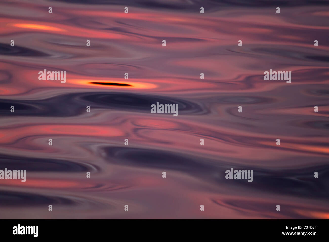 Water ripples reflecting beautiful sunset colors Stock Photo - Alamy