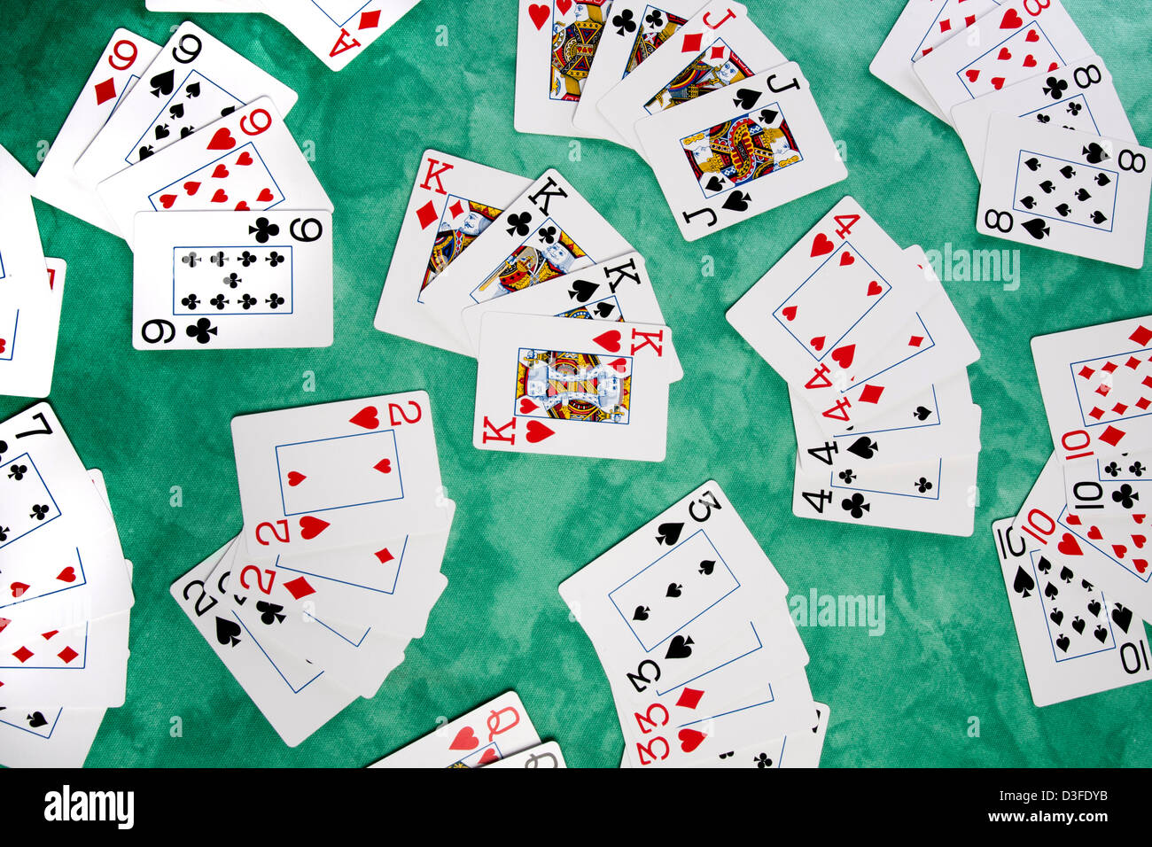 Close up view of a bunch cards spread on a green cloth table Stock ...