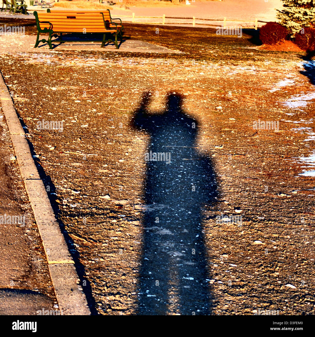 Man's shadow on ground waving Stock Photo - Alamy