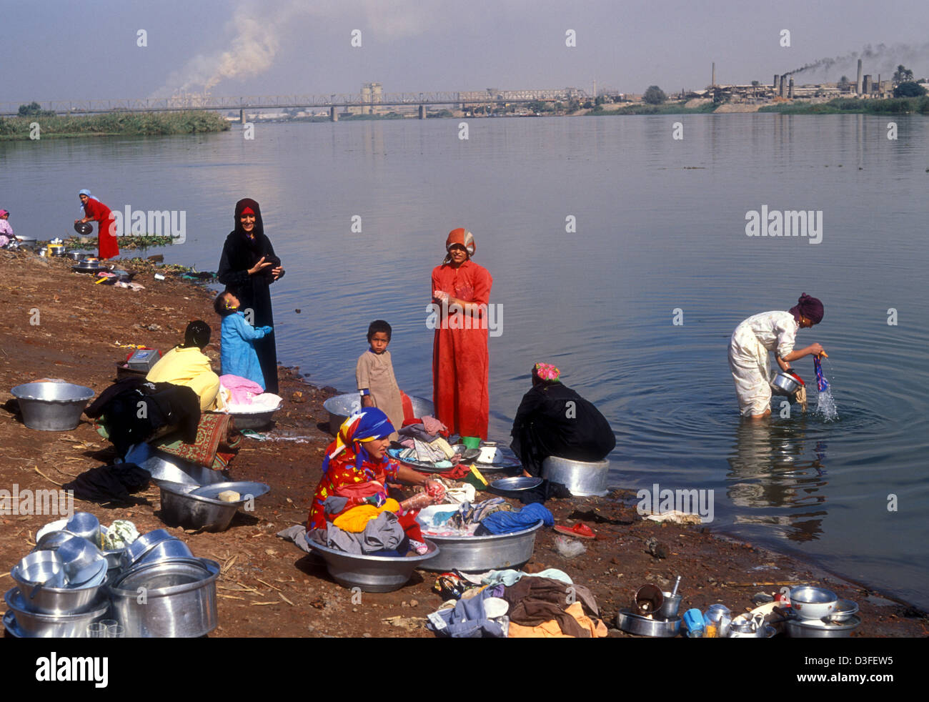 Egyptian women doing the laundry in the Nile, Middle Egypt Stock Photo ...