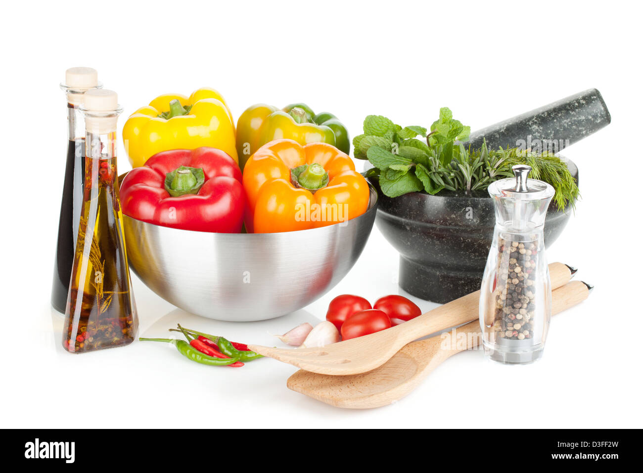 Fresh bell peppers, herbs and condiments. Isolated on white background ...