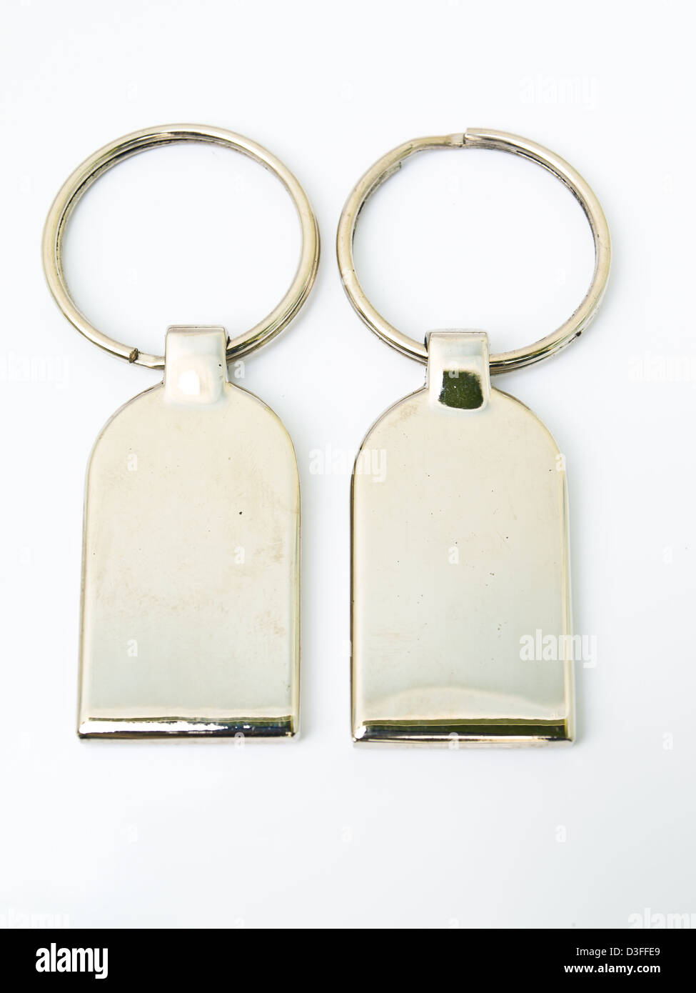A pair of metalic trinket keychain isolated on white background Stock ...