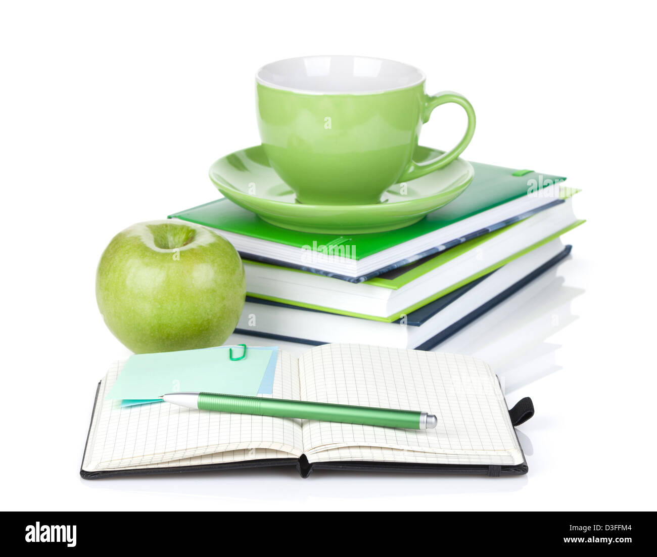 Ripe green apple, coffee cup and office supplies. Isolated on white ...