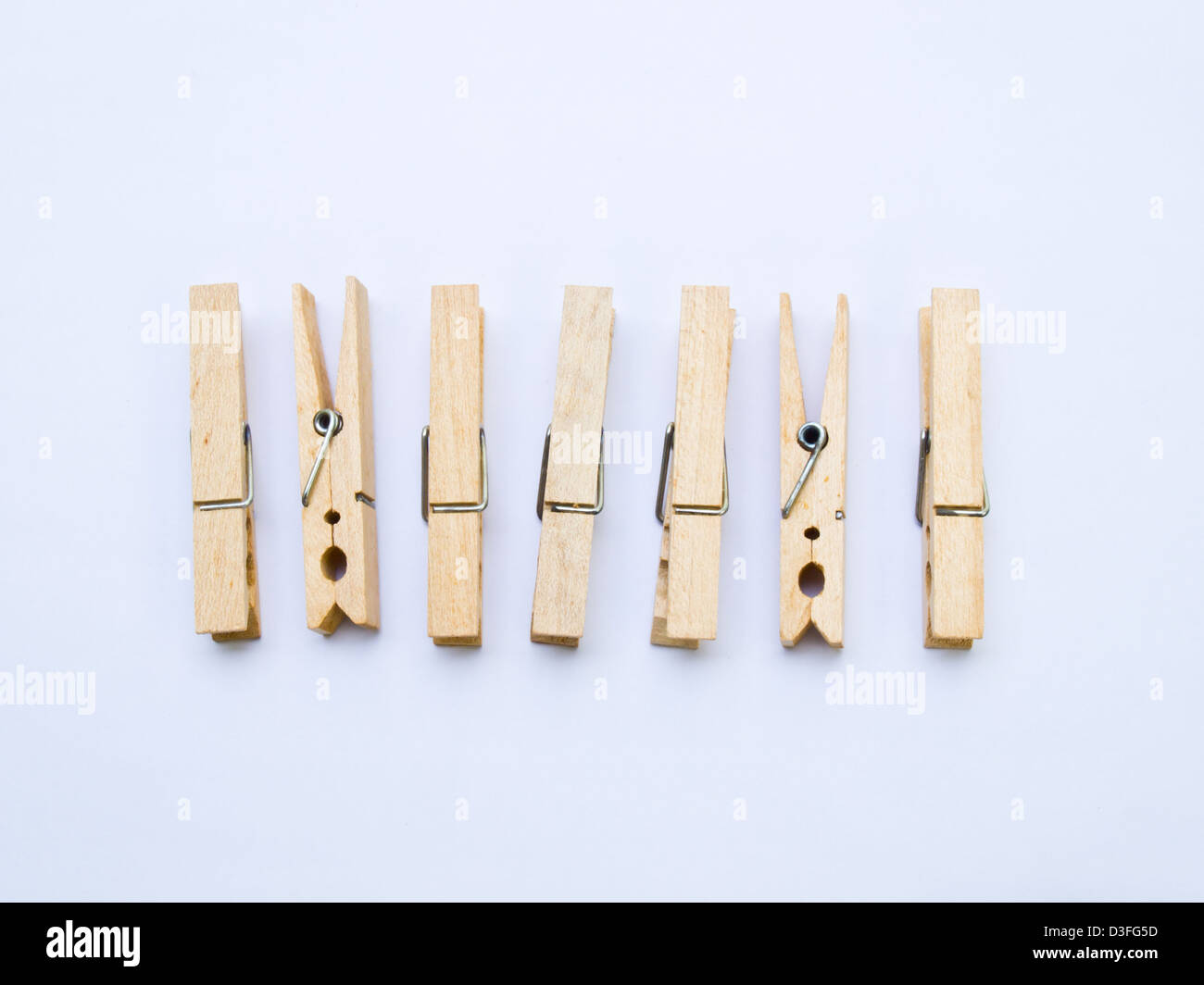 Wooden clothes clips isolated on white background Stock Photo - Alamy