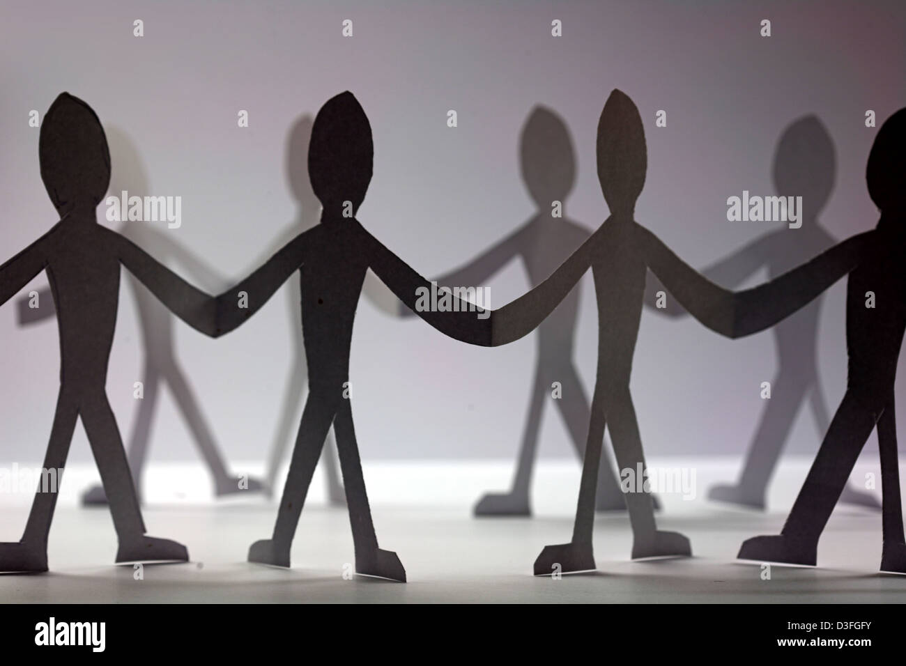 small rudimentary figures of man in paper Stock Photo - Alamy