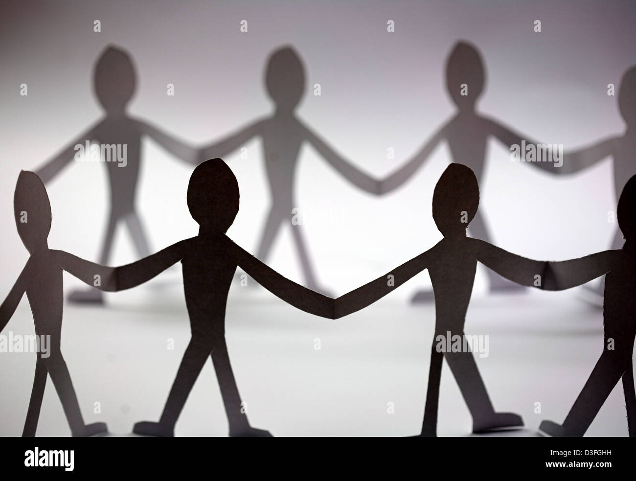 small rudimentary figures of man in paper Stock Photo - Alamy