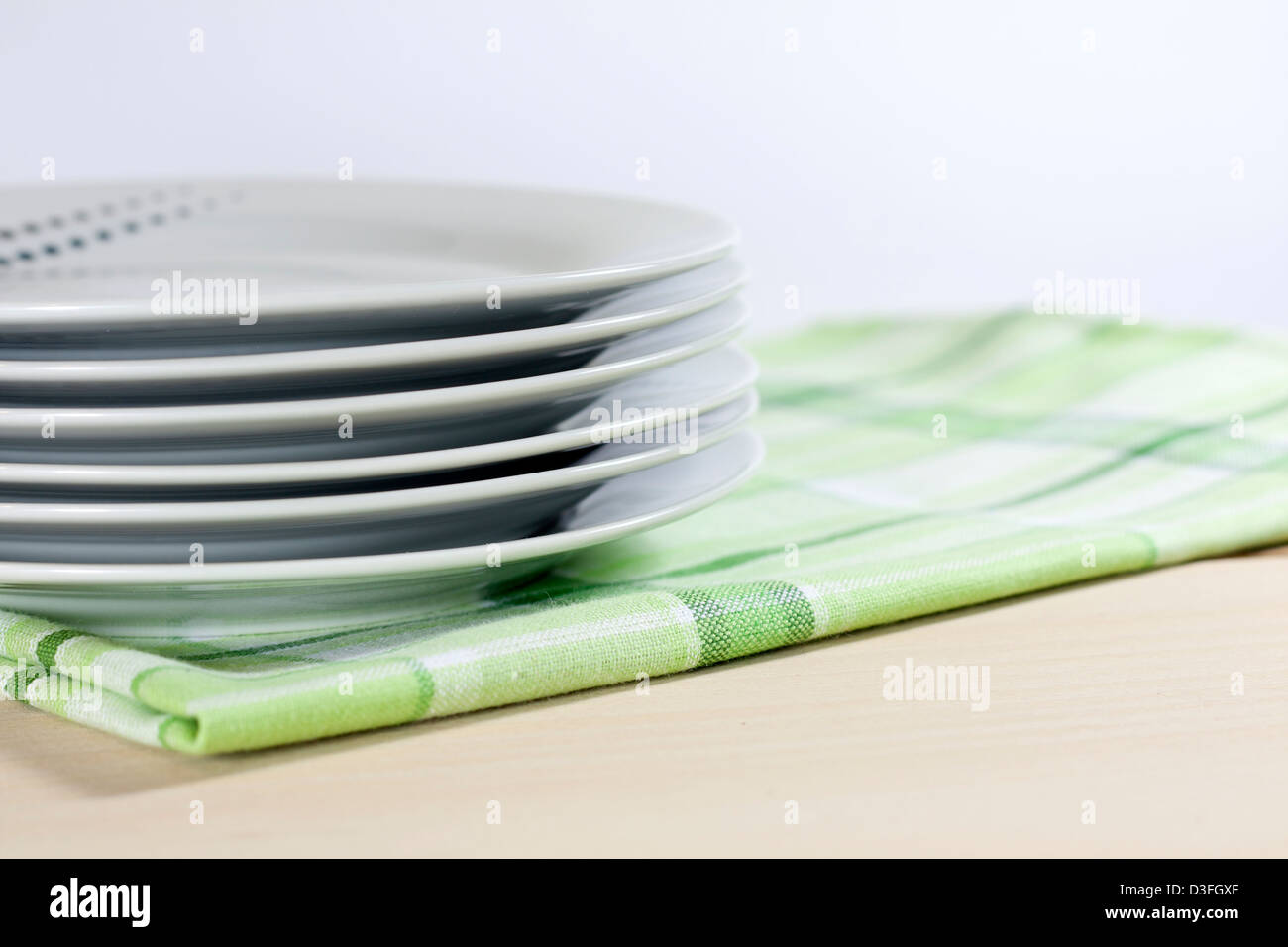 Plates on tablecloth in kitchen abstract food background Stock Photo ...