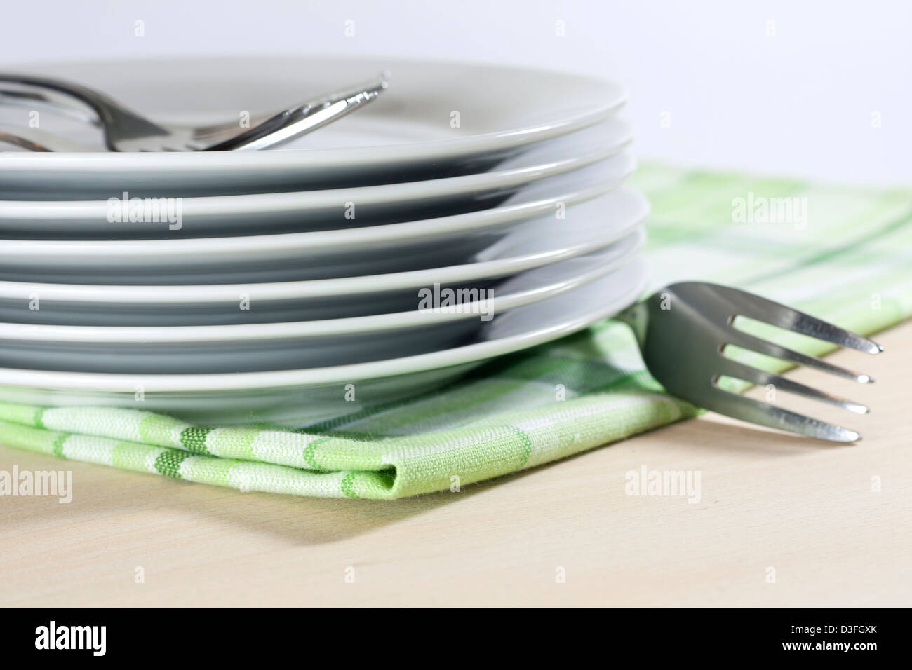 Plates on tablecloth in kitchen abstract food background Stock Photo ...