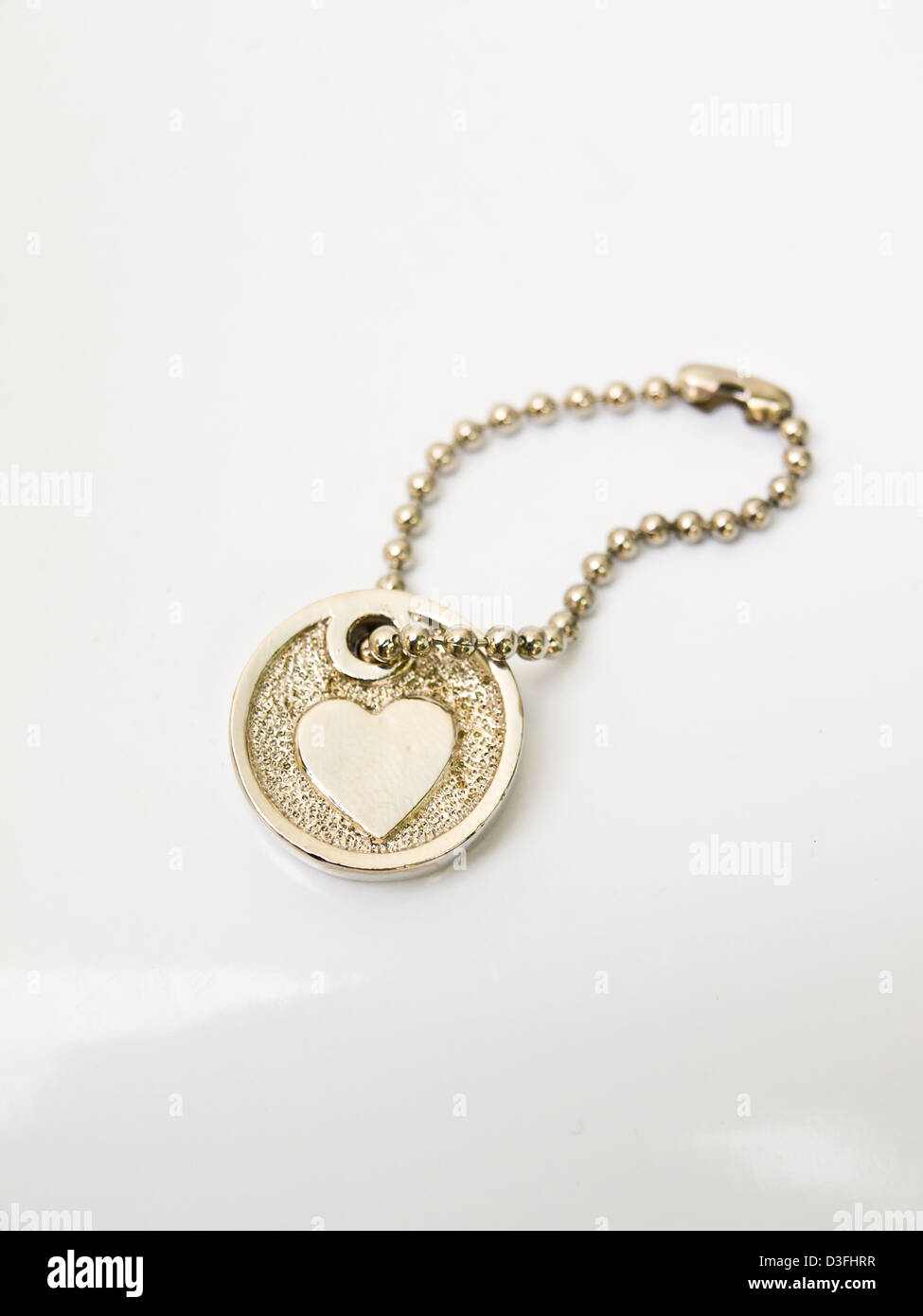 Miniature heart keychain is a universal symbol of love Stock Photo - Alamy