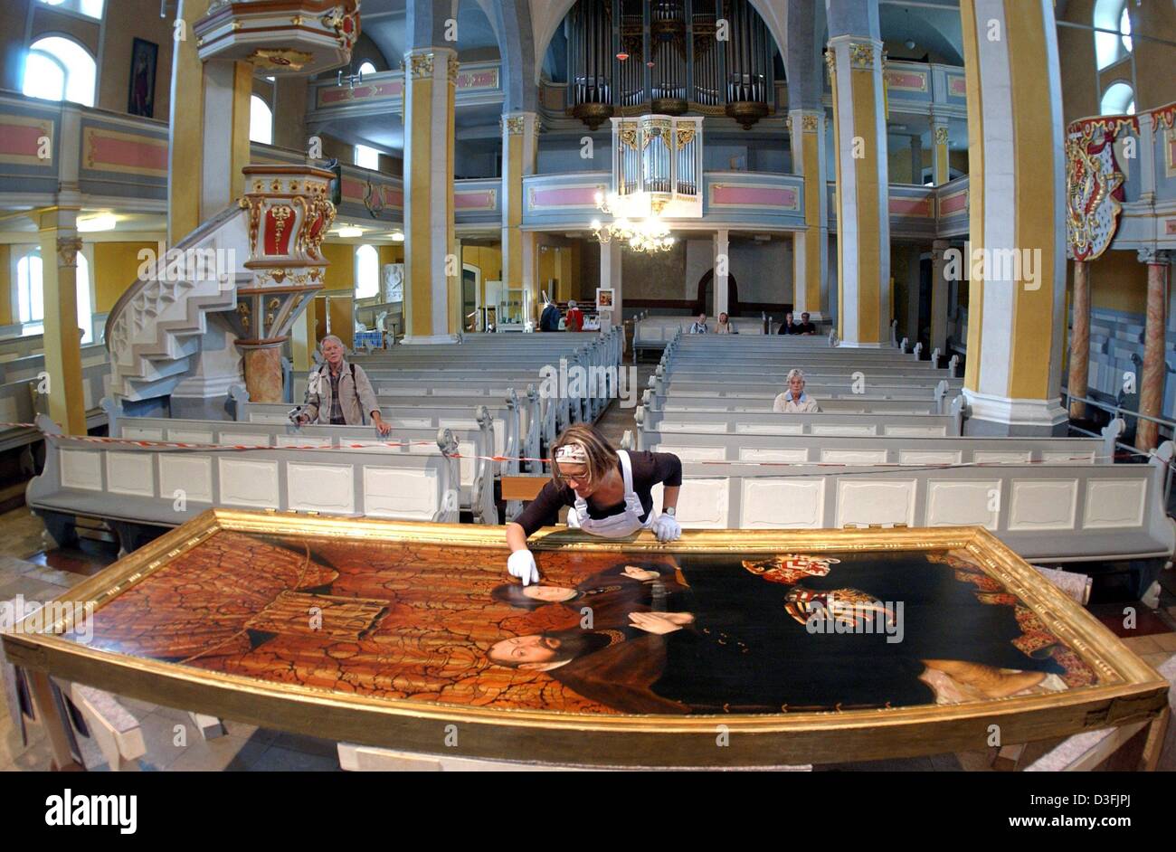 (dpa) - Restorer Angela Guenther looks at a side wing of the valuable ...