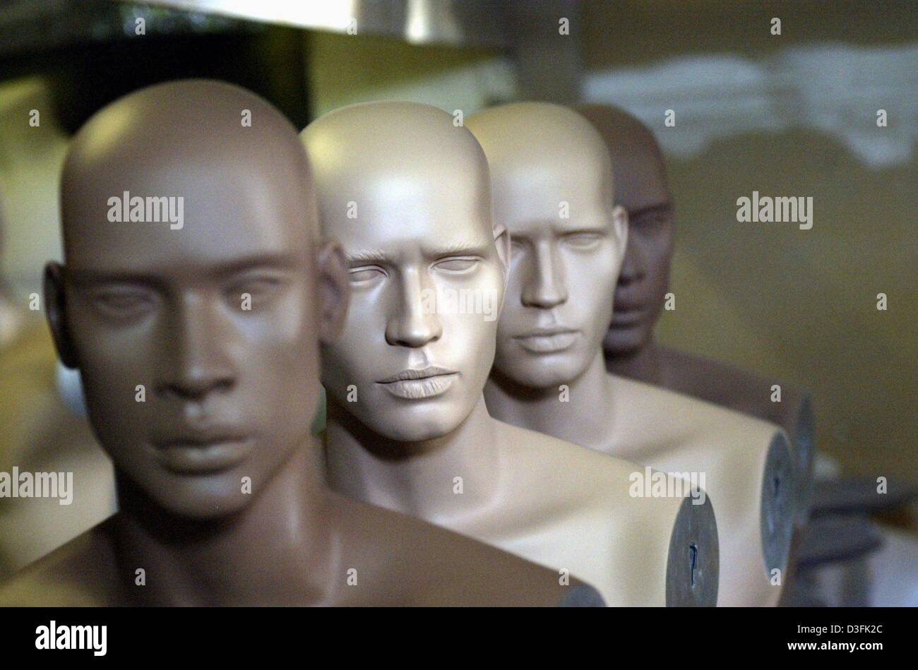 (dpa) - Shop window dummy are lined up before they are dressed and made ...