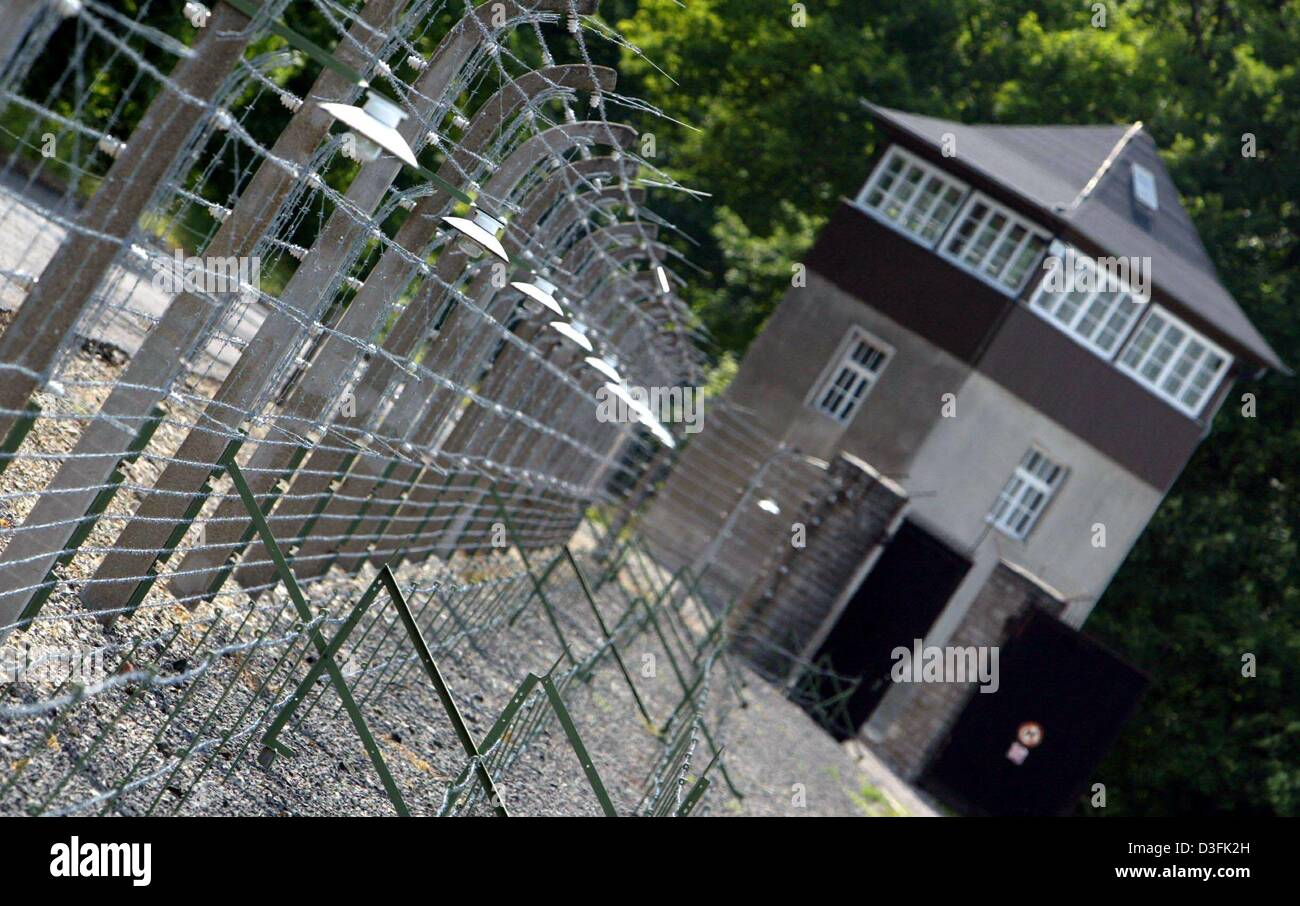 (dpa) - A view of the high security fences and a watch tower of the ...